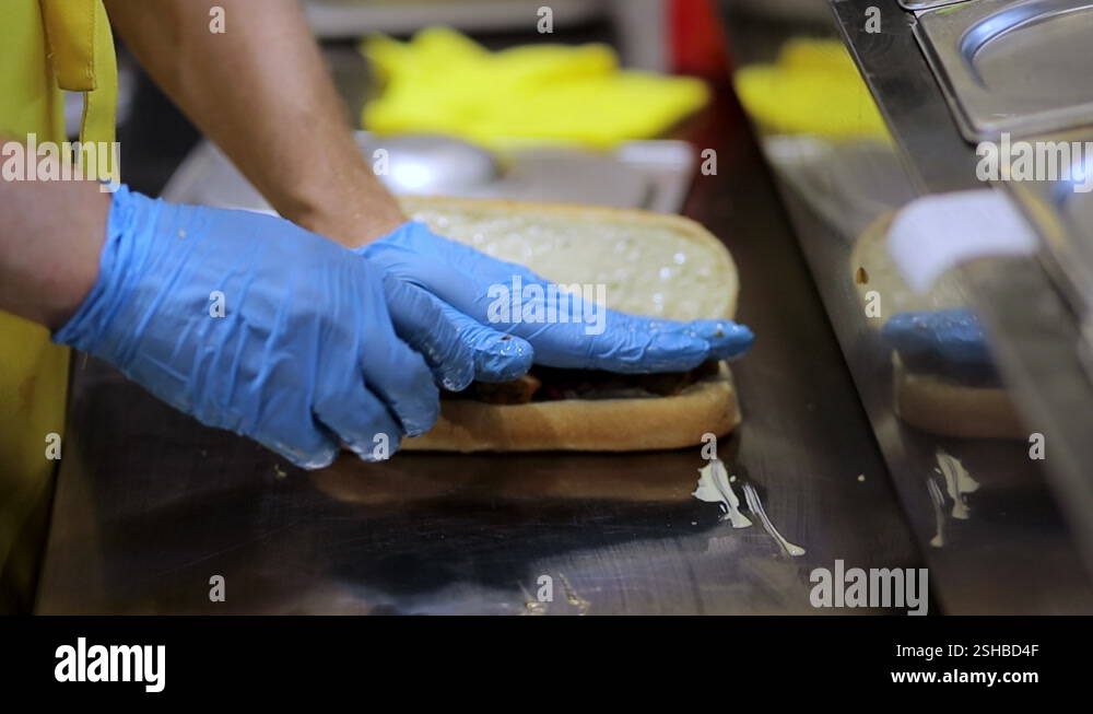 Doner sandwich. chef prepares doner in a bun Stock Video Footage - Alamy