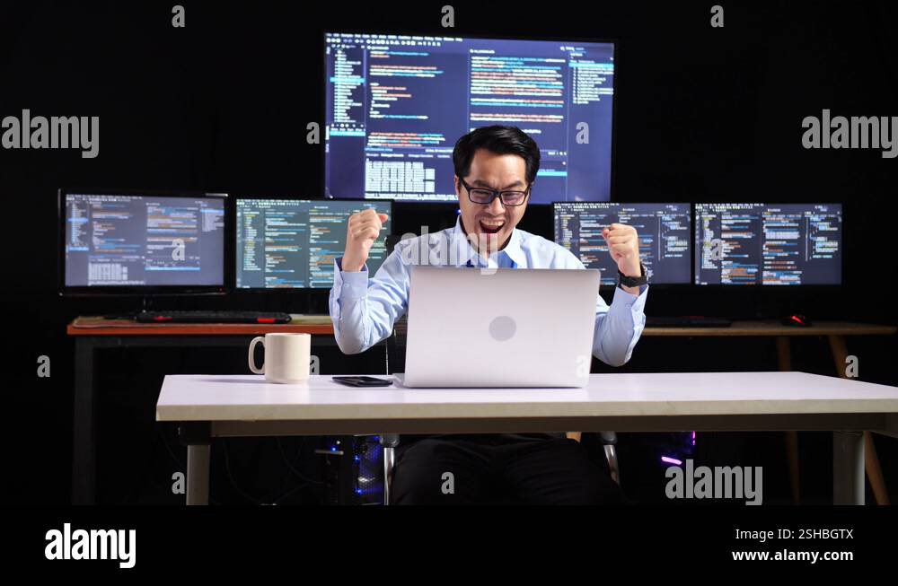 Asian Male Programmer Celebrating Succeed Writing Code By A Laptop ...