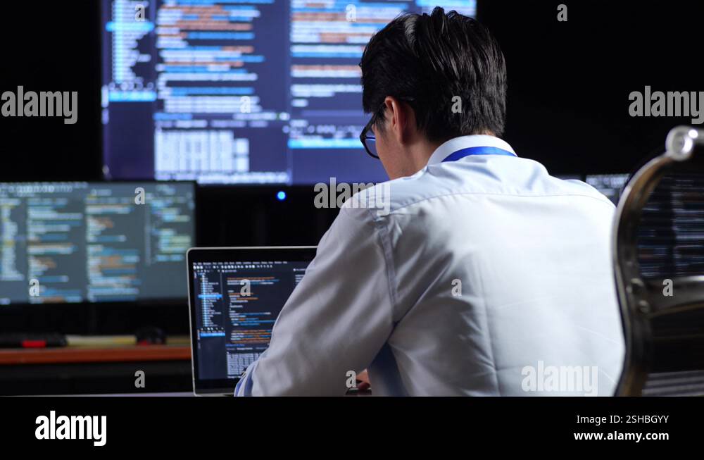 Close Up Back View Of Asian Male Programmer Writing Code By A Laptop ...