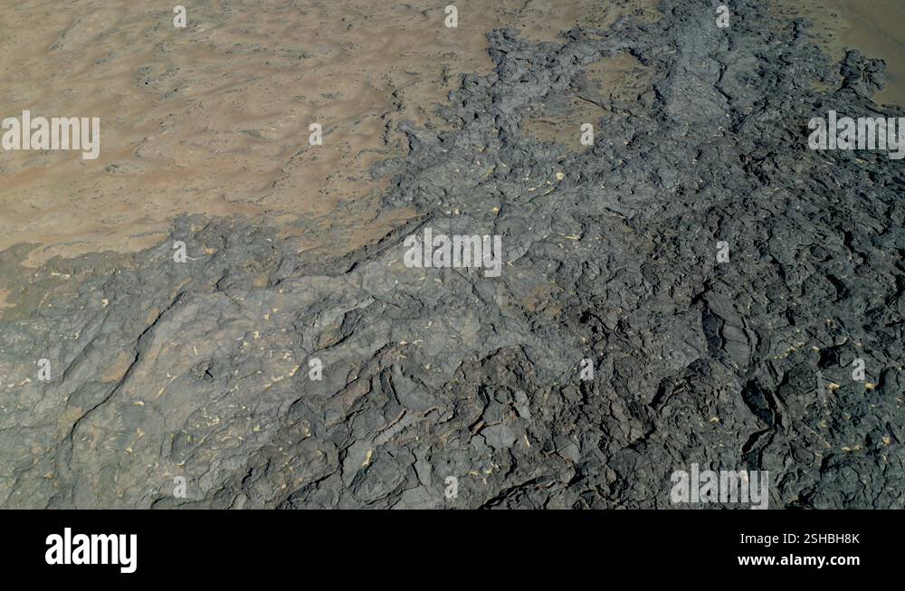 Aerial views of the black volcano (Jabal Qidr) Harrat Khaybar west ...