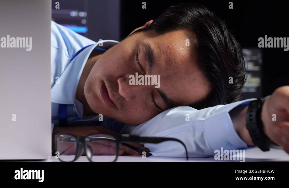 Close Up Of Asian Male Programmer Sleeping While Writing Code By A Laptop Using Stock Video ...