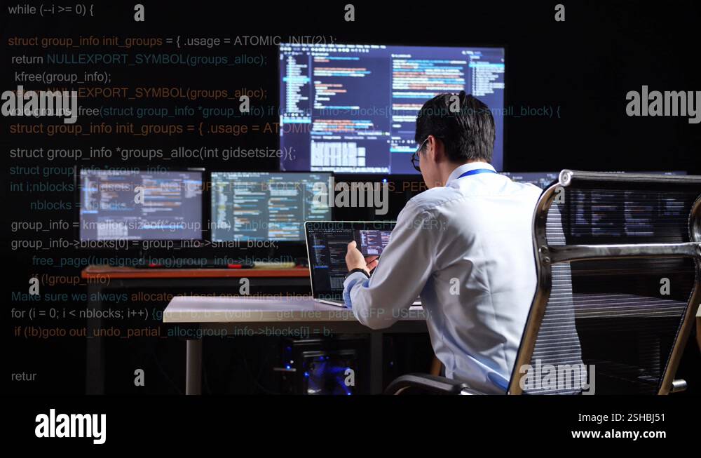 Back View Of Asian Male Programmer Looking At Database On Smartphone Stock Video Footage - Alamy