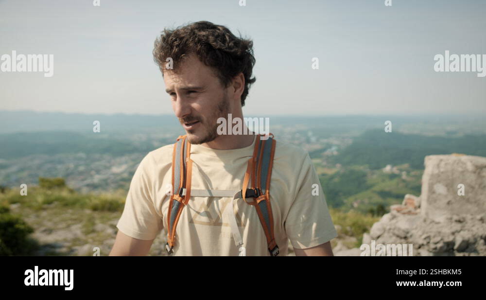 Hiker on the top of mountain Sabotin looking at the view. In the Stock ...