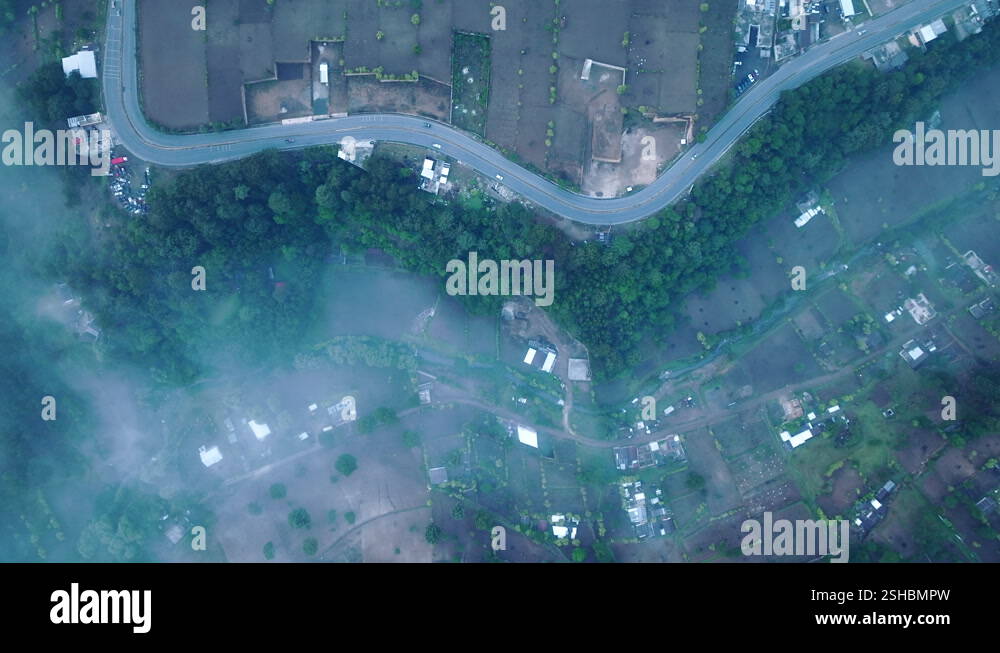 Top down static aerial footage of a road in which cars are driving in the Stock Video Footage ...