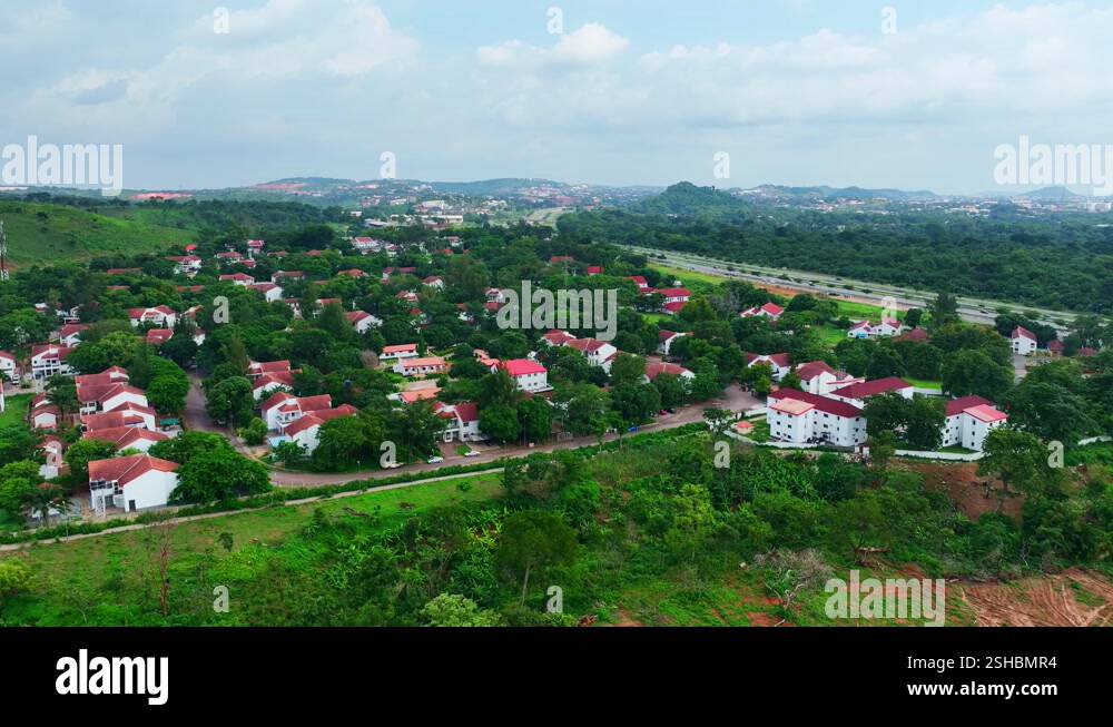 Aerial - forward approach shot of a gated community in Sub saharan ...