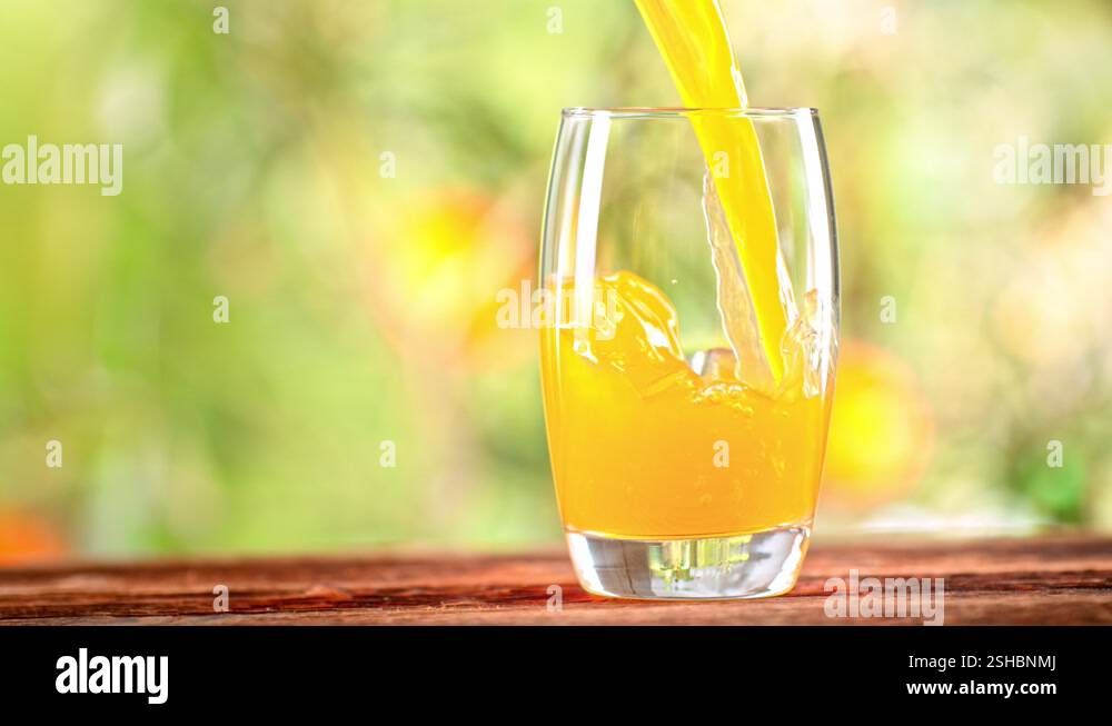 Super Slow Motion Shot of Pouring Fresh Orange Juice into Glass at 1000 fps Stock Video Footage ...