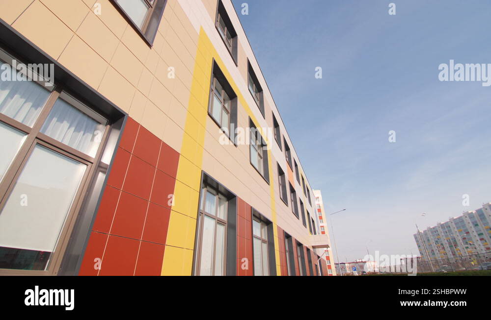 Stylish colorful school building in residential district Stock Video ...