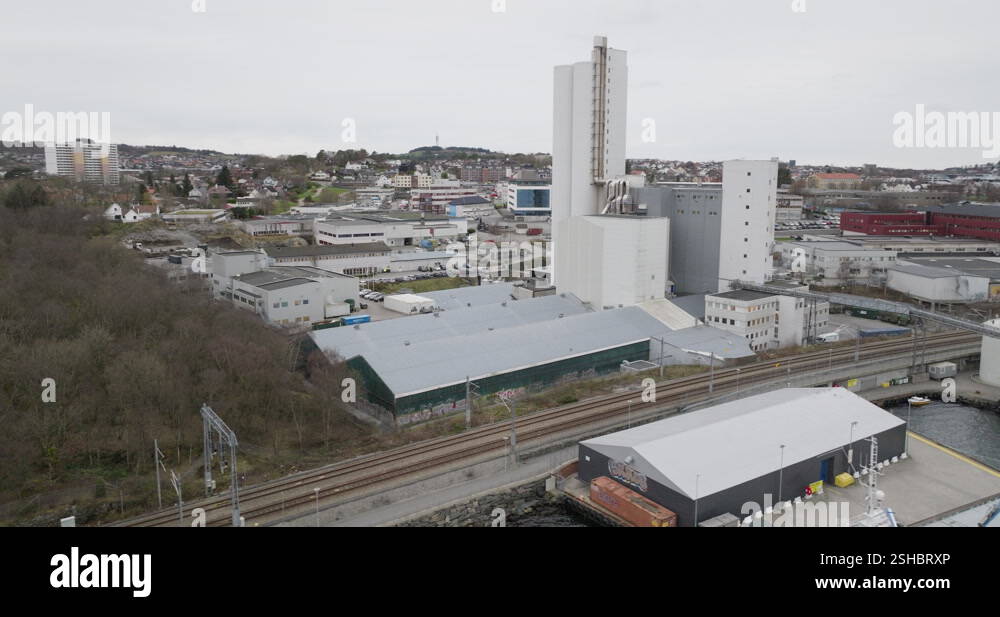 Aerial arc shot of fish feed manufacturing factory in Stavanger, Norway ...