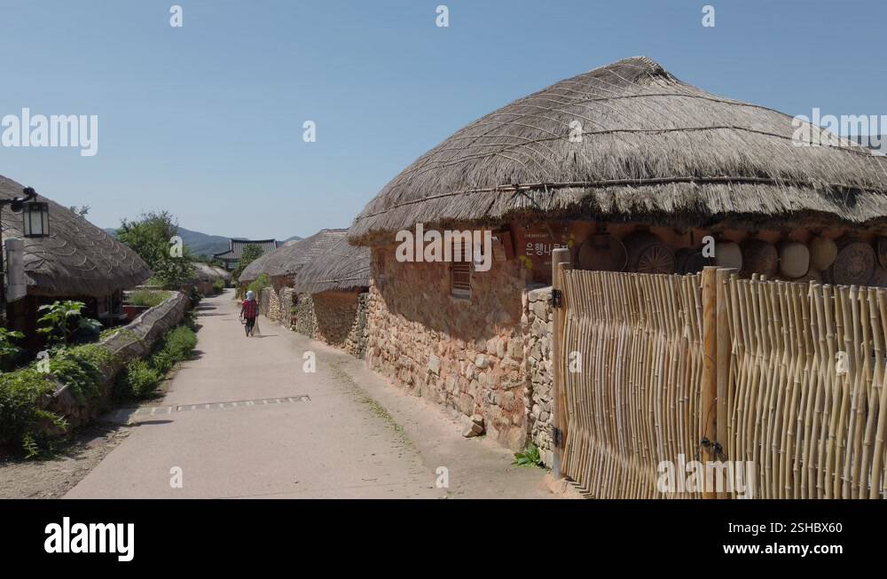 A Village Maintenance Worker With A Broomstick Walking On A Path ...