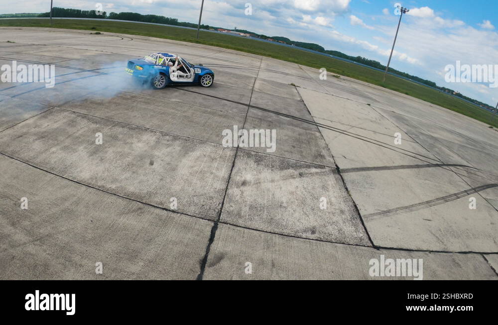 Drone view of race car drift on asphalt road tire skid mark with lot of ...