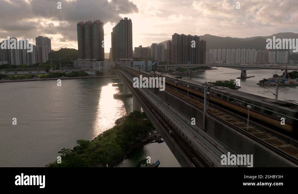 MTR train drives over a girder bridge towards Tsing Yi, Hong Kong Stock ...