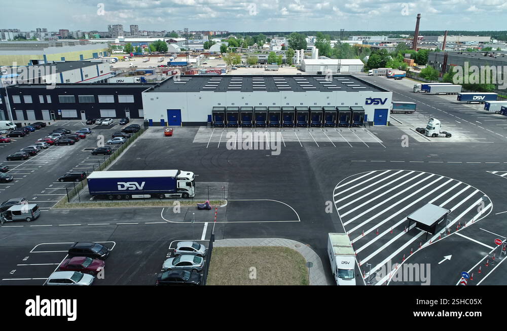 DSV logistic center with many docks for trucks, aerial fly forward view ...