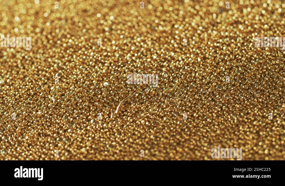 Gold Pellets Stock Video Footage - Alamy