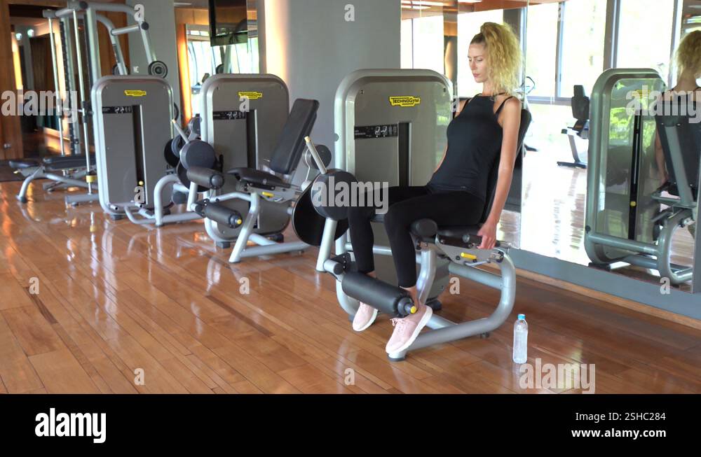 Beautiful Fit Blonde Woman Working Out her Legs In The Resort Private ...
