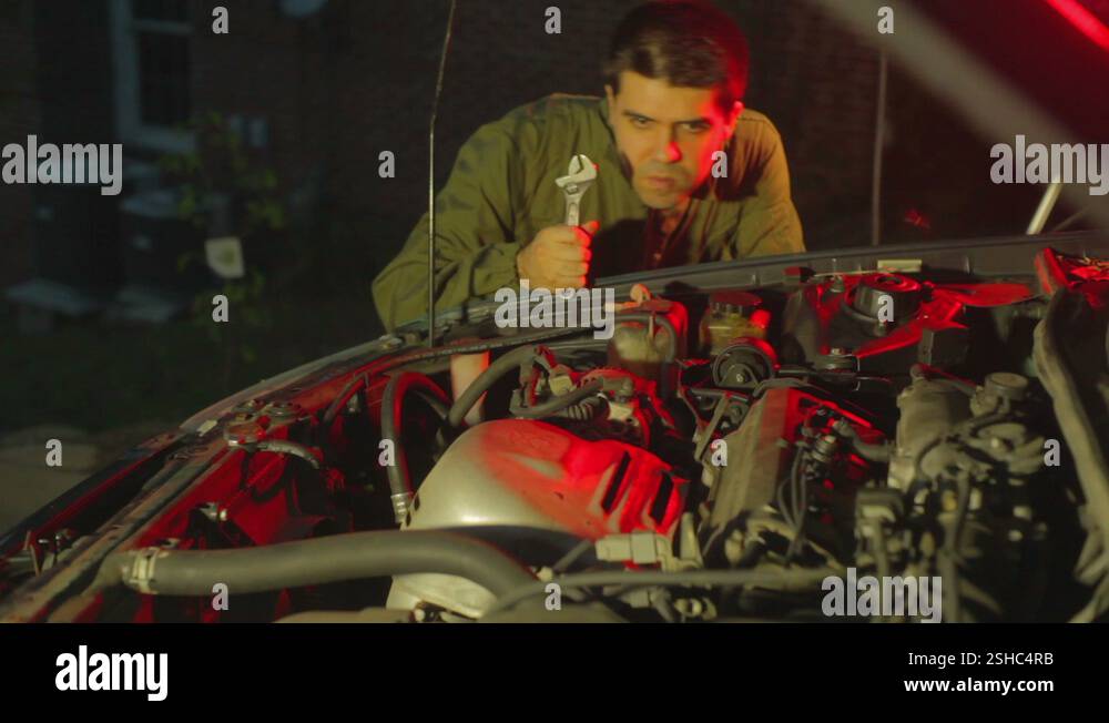 mechanic wrench looking engine grease monkey Stock Video Footage - Alamy