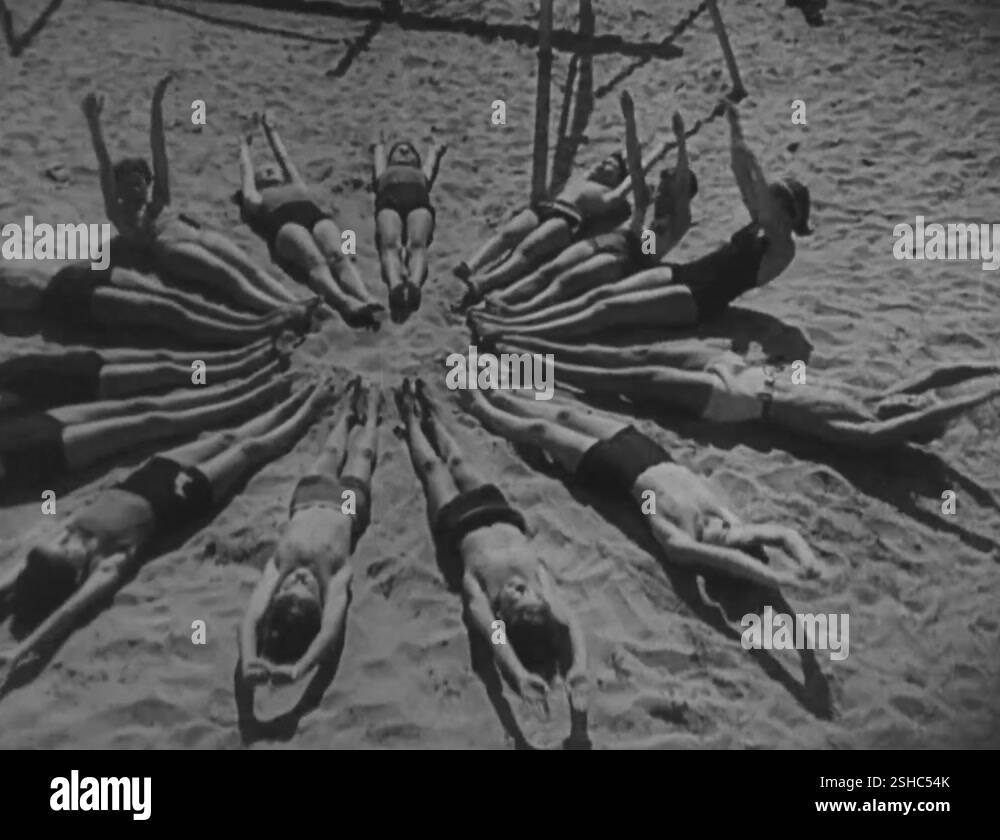 France - 1940s: Group exercise on beach Stock Video Footage - Alamy