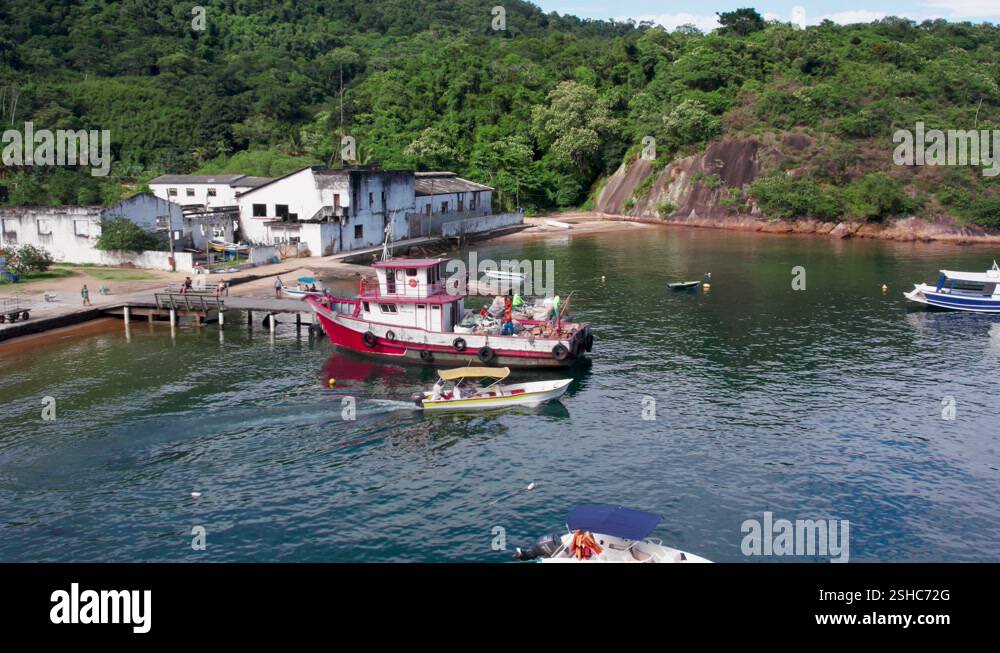 Labors Loading Trash In Garbage Boat Anchored At ilha Grande Island ...