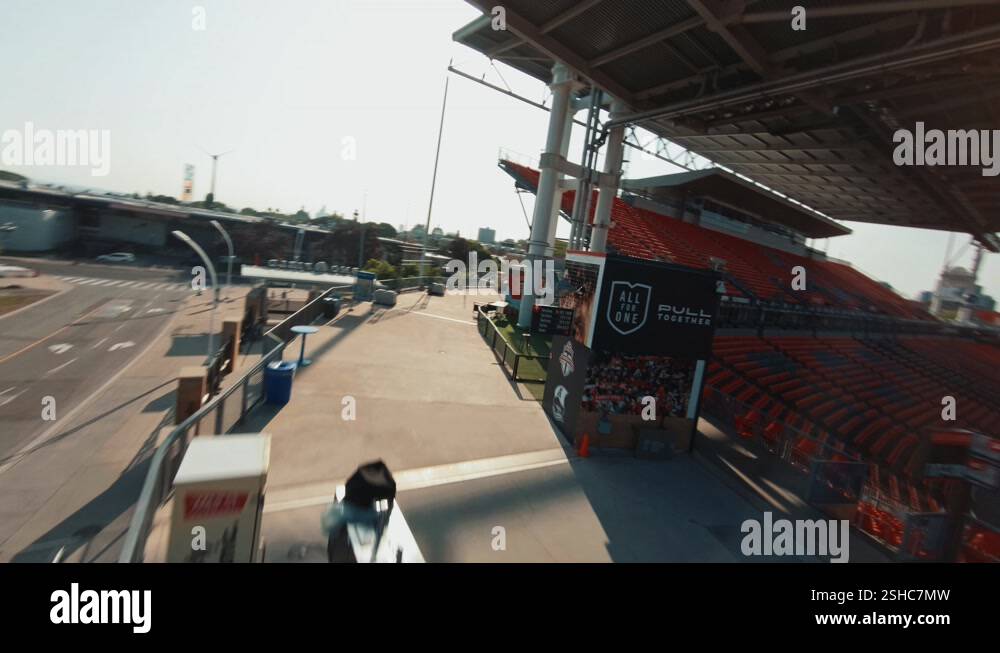 FPV drone flies past flags and through stadium at BMO soccer football ...