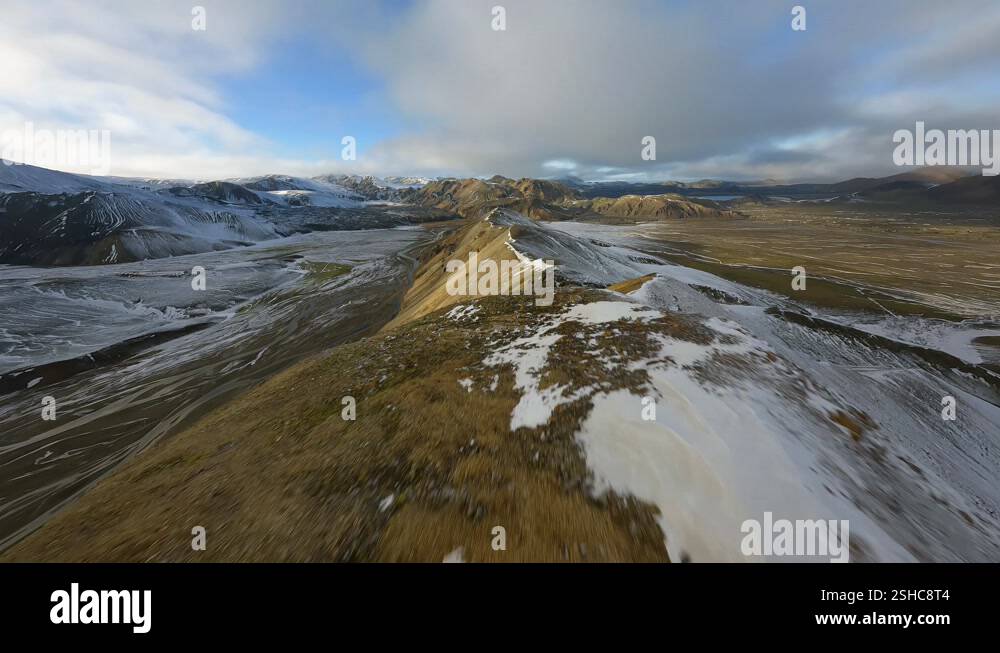 Flying parallel to a mountain ridge, sunny winter day in Iceland - FPV ...