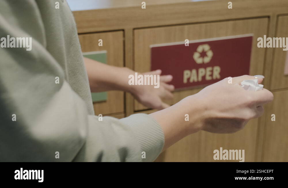 Womans hand crumple, crush sheet of paper ball and throw it in a ...