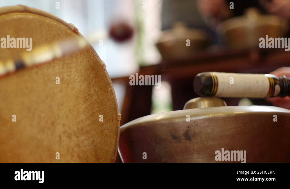 Skinned drum and south east Asian bonang gamelan continuously struck by ...