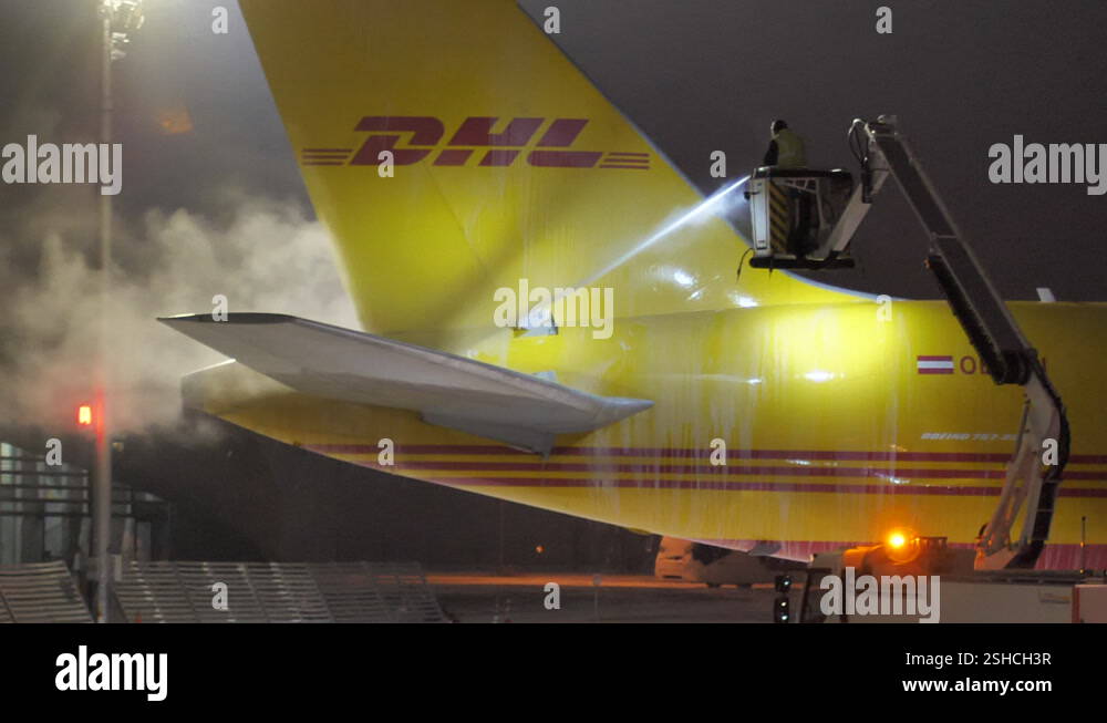 Tail and Elevator of DHL Freighter Airplane Getting De-icing Treatment ...