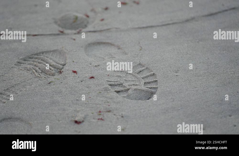 Shoe footprint in the sand on the beach. Footprint from a boot in the ...