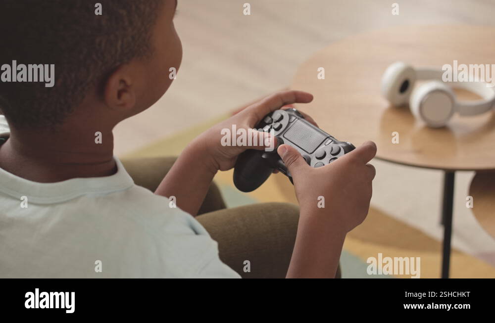 Boy with Controller Playing Video Game Stock Video Footage - Alamy
