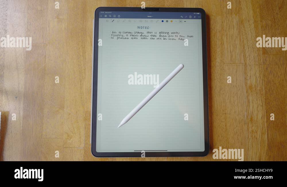 Taking notes on an iPad with an apple pencil. Taking notes on a tablet ...