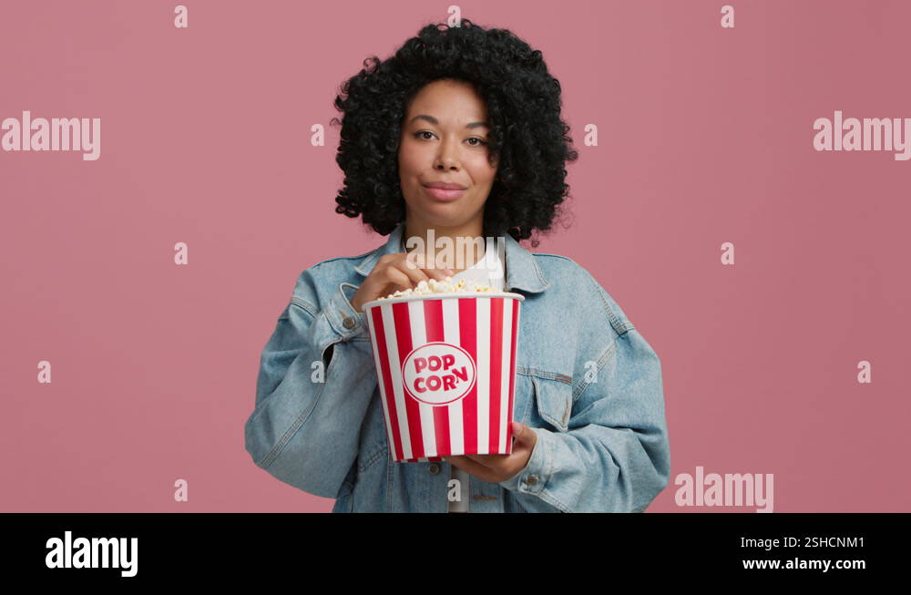 slow motion 4K Satisfied afro girl enjoying movie, woman of color ...