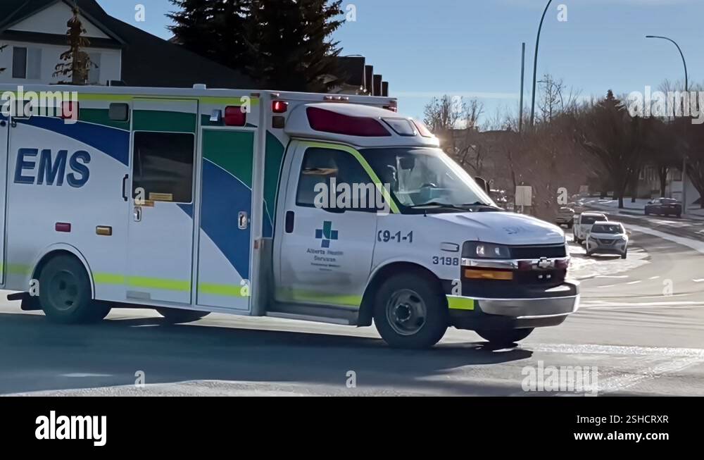 An ambulance responding to an emergency and driving fast with the siren ...