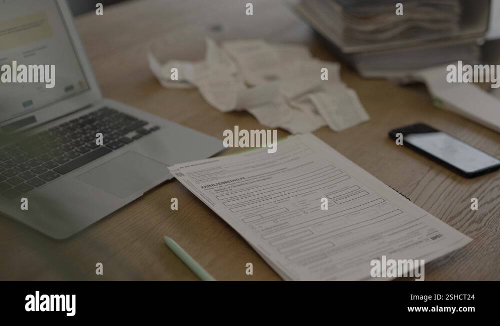 Family allowance form in German language in the hands of a female Stock ...