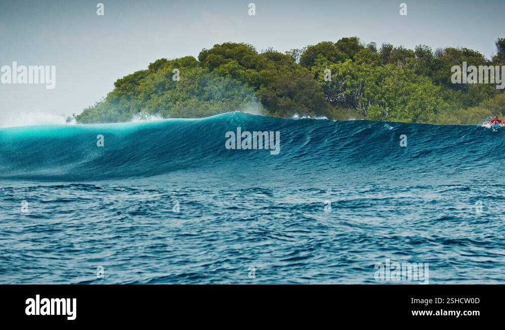 Big ocean wave breaks in the Maldives and covers the island Stock Video ...