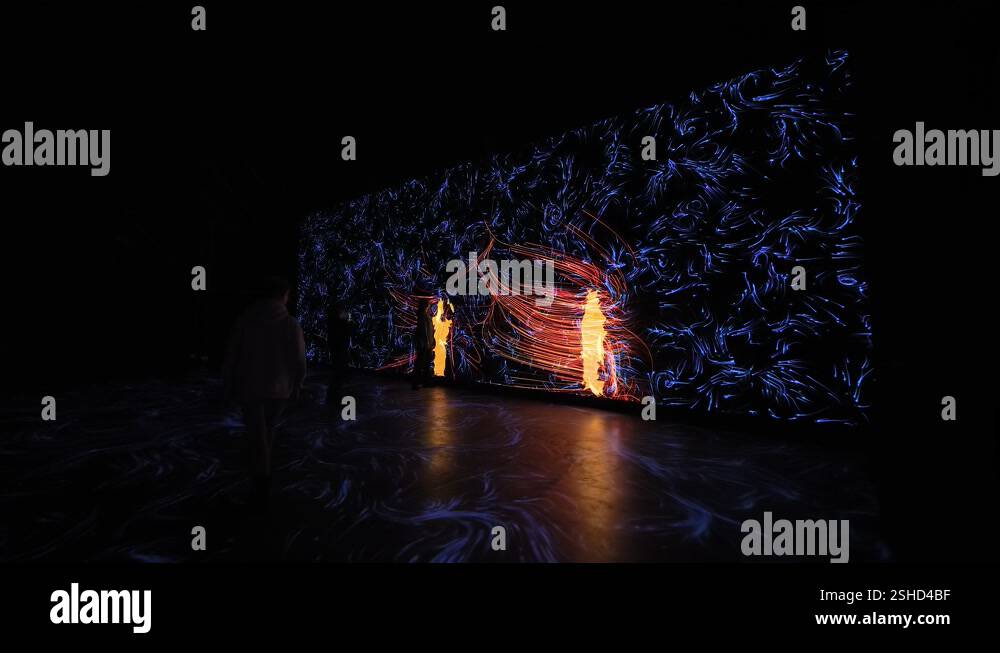 People moving in front of wide AR display at immersive exhibition: wide ...