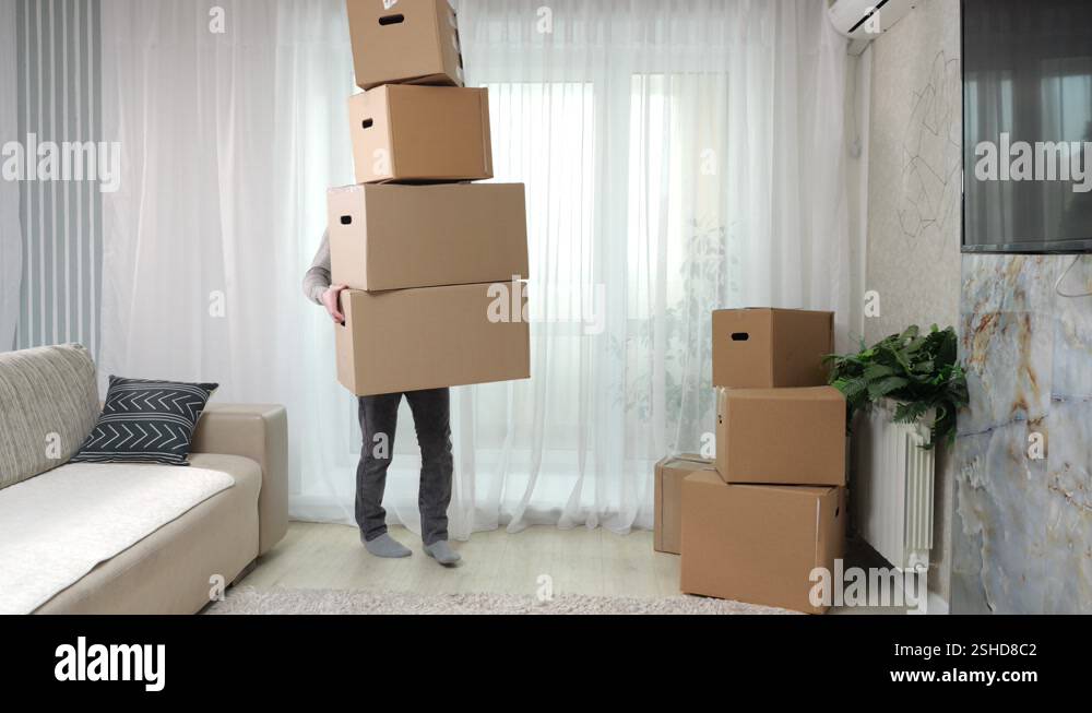 Man carries boxes stack and falls on floor in new apartment Stock Video ...