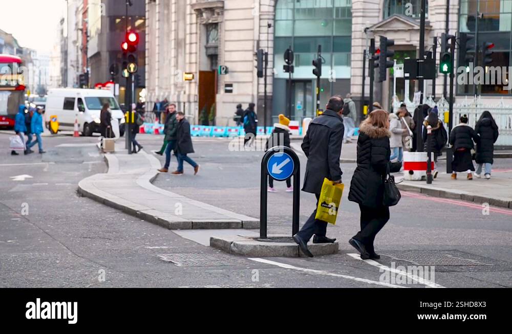 People crossing Eastcheap Street near Monument in London, slow motion ...