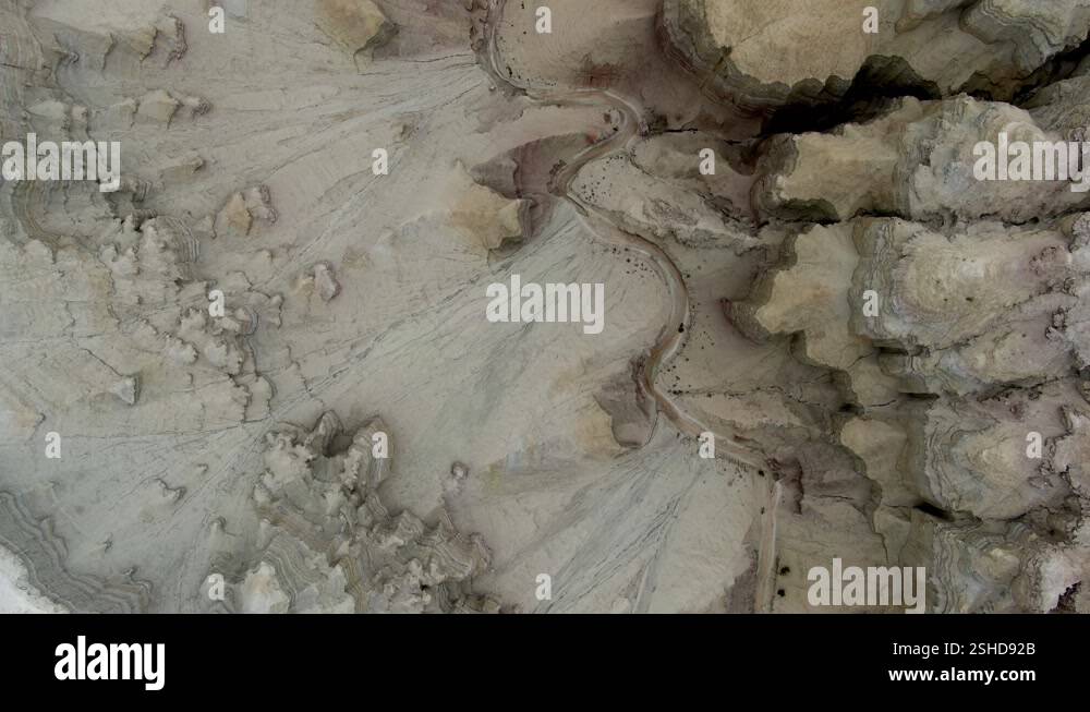 Harsh Aktau Mountain terrain, deep fissure, jagged edge, eroded sand ...