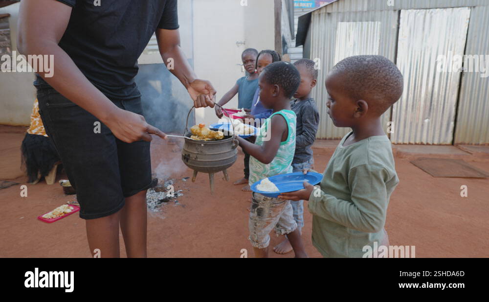 Poverty in Africa. Hungry Black African children holding out plates for ...