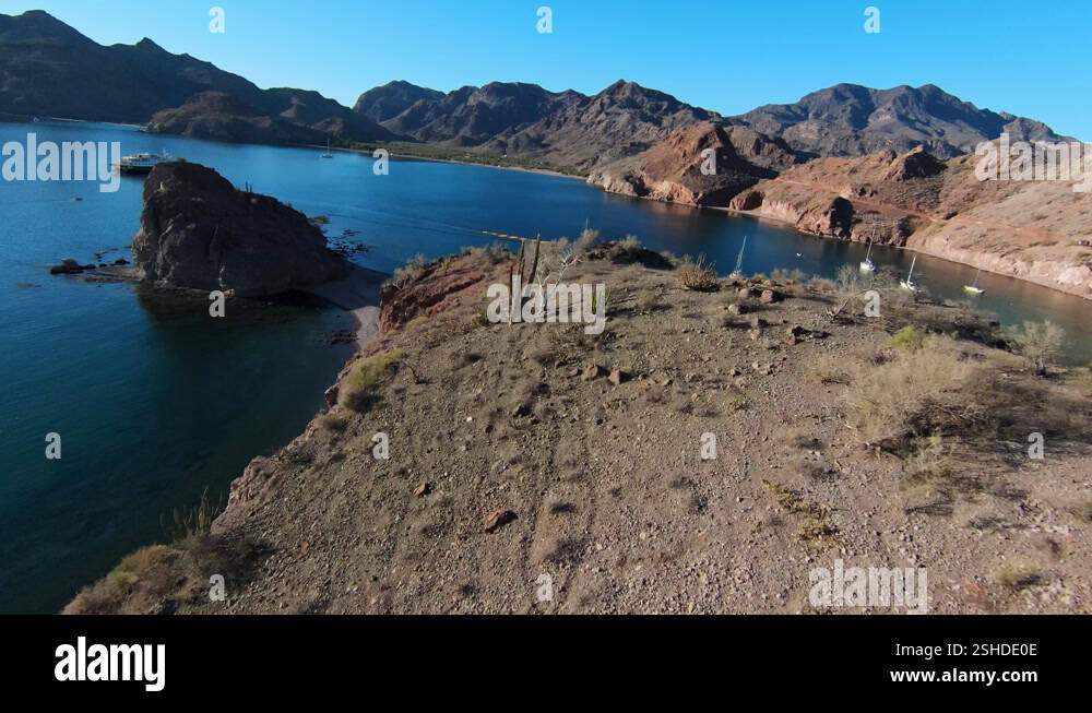 Fpv Drone Shot Over Coastal Arid Dry Hill Overlooking Sea Bay and ...