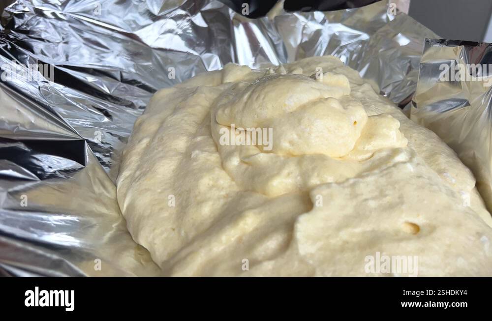 airy biscuit dough on foil slowly falling down dough foam making a pie ...