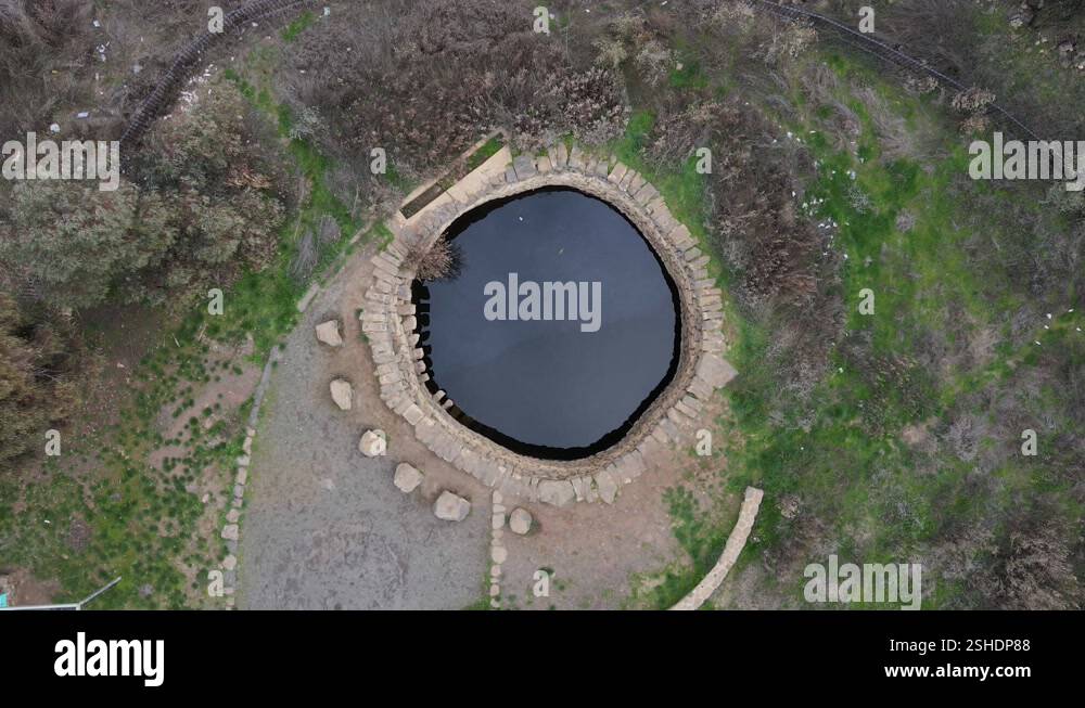 Natural water pool spring, Ein Mokesh, Israel, drone pulling away ...