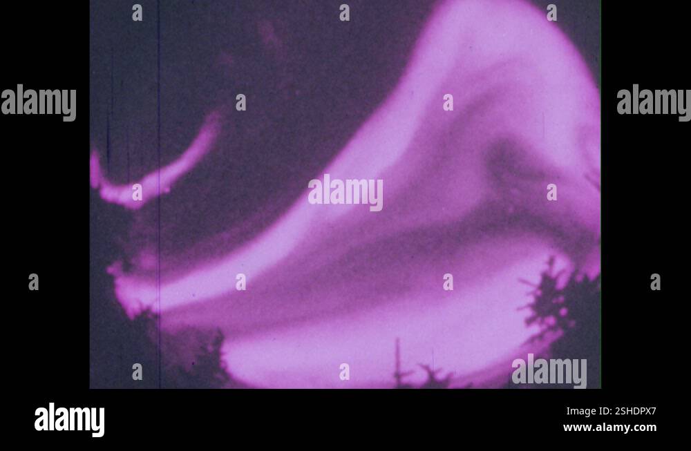 1970s: Moon moving over surface of the sun. Small body of Moon travels ...