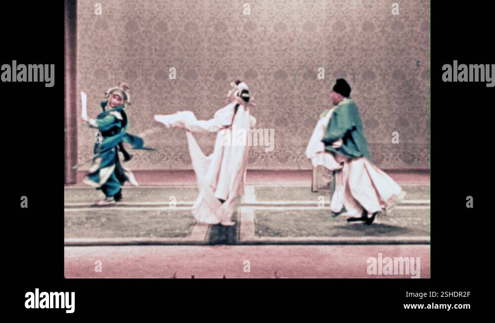 1950s: People onstage at the Peking Opera in costume. People dance and ...