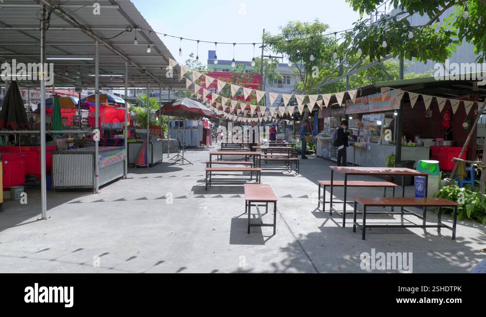 A stationary handheld shot of an open food court at the Central Plaza ...