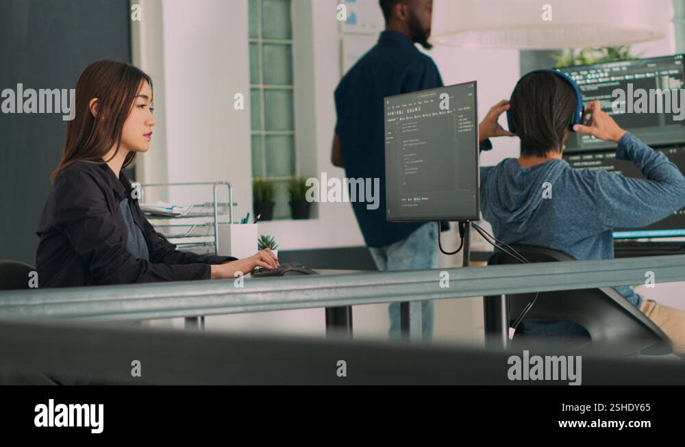 Database programer writing source code with coding language in it ...