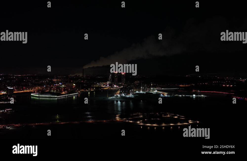 Aerial view rising towards Illuminated Sompasaari, Tervasaari and Stock ...