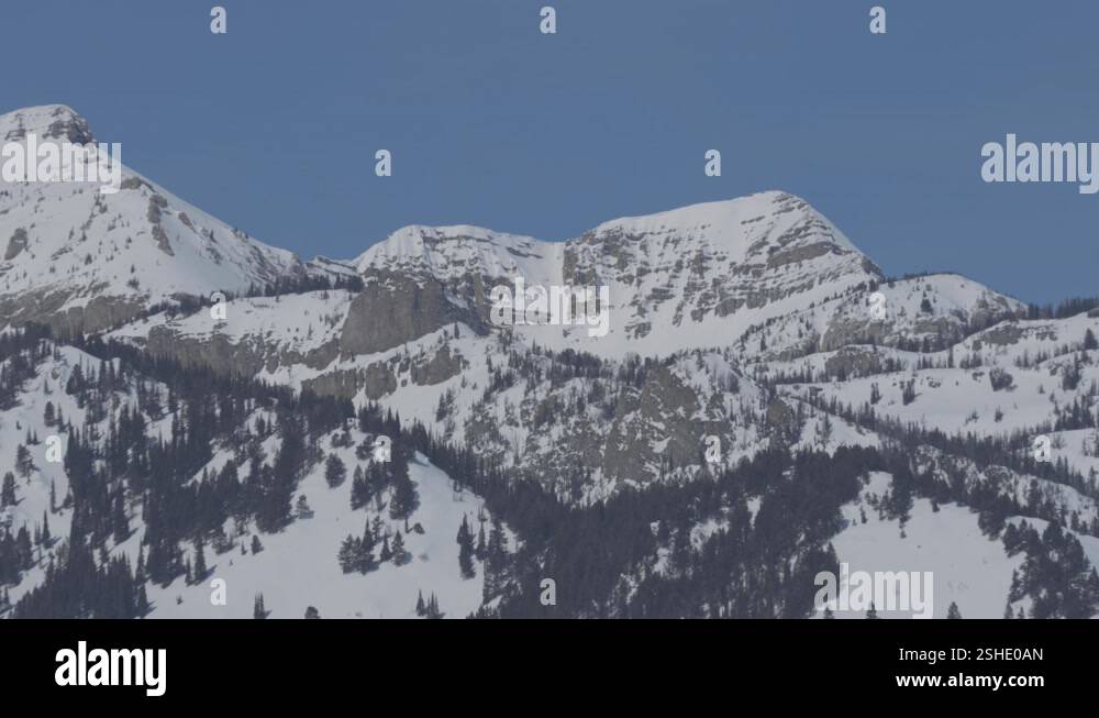 Zoom out from high mountain cliffs in western Wyoming. Shot in 4K Stock ...