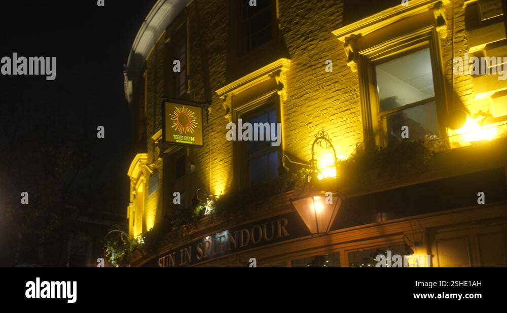 Bright Glowing Lights Illuminated Facade Of An Urban Pub In Notting ...