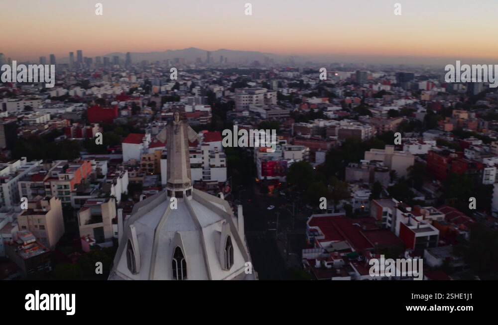 Dynamic wide swooping drone shots of massive Jesus status towering over ...