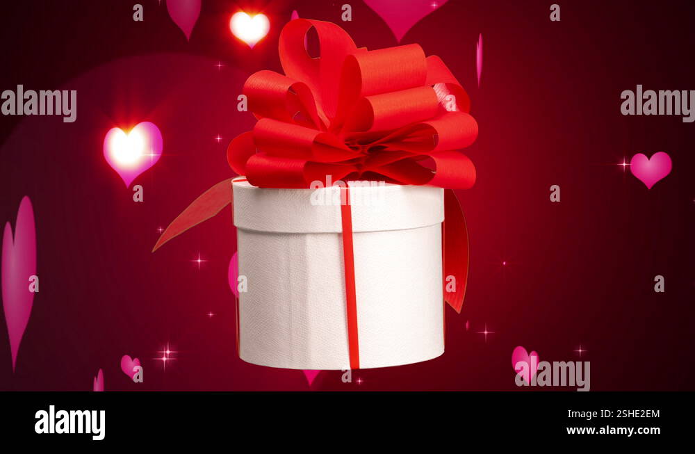 Gift box spinning with red bow Stock Video Footage - Alamy